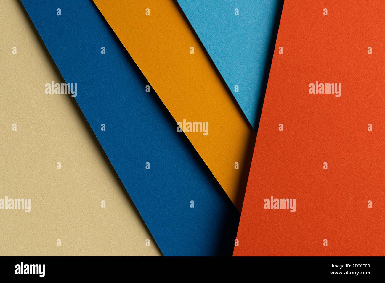 From above layout of colorful cardboard sheets in orange and blue ...