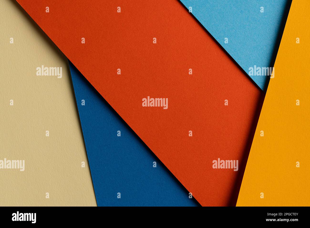 From above layout of colorful cardboard sheets in orange and blue ...