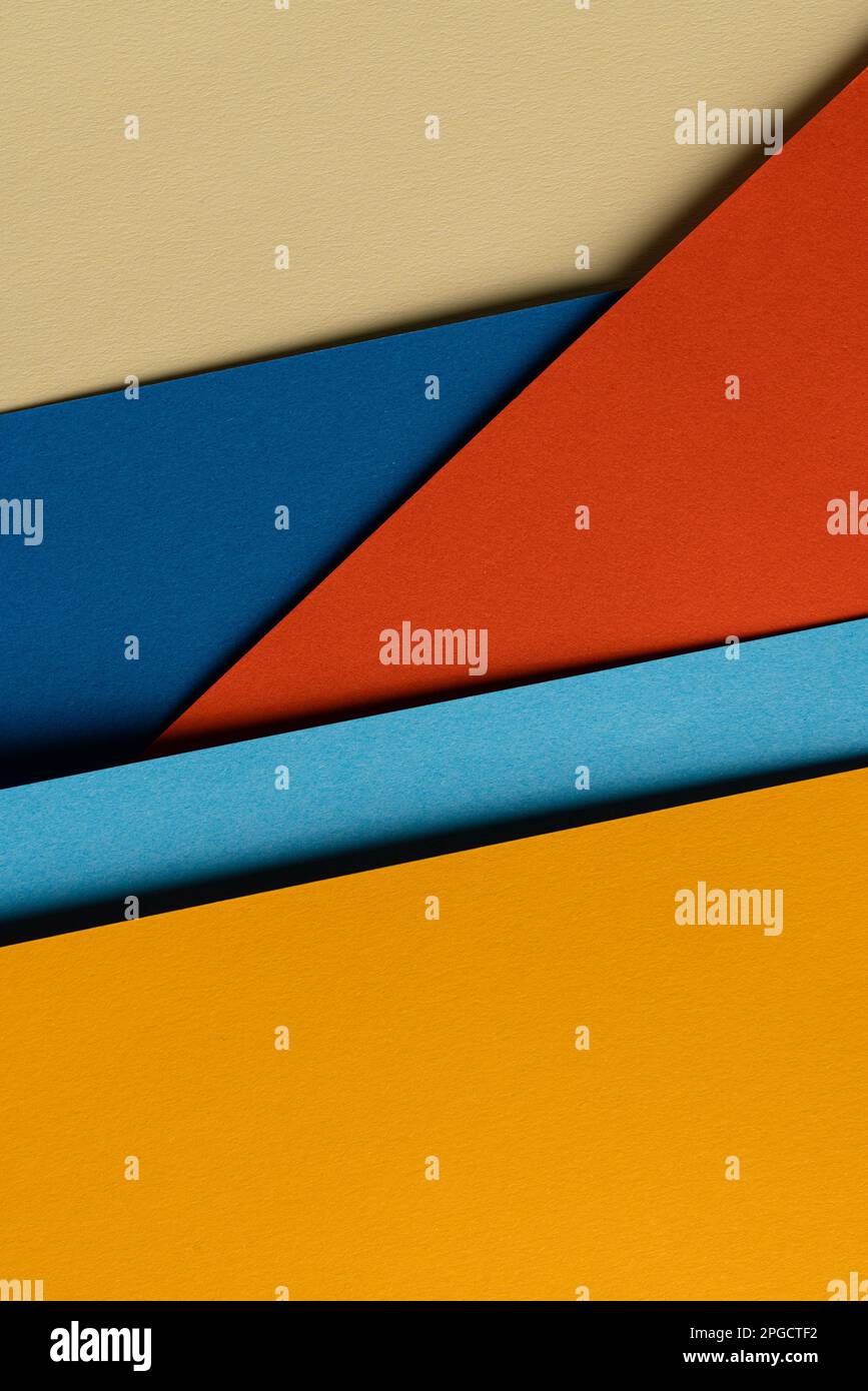 From above layout of colorful cardboard sheets in orange and blue ...
