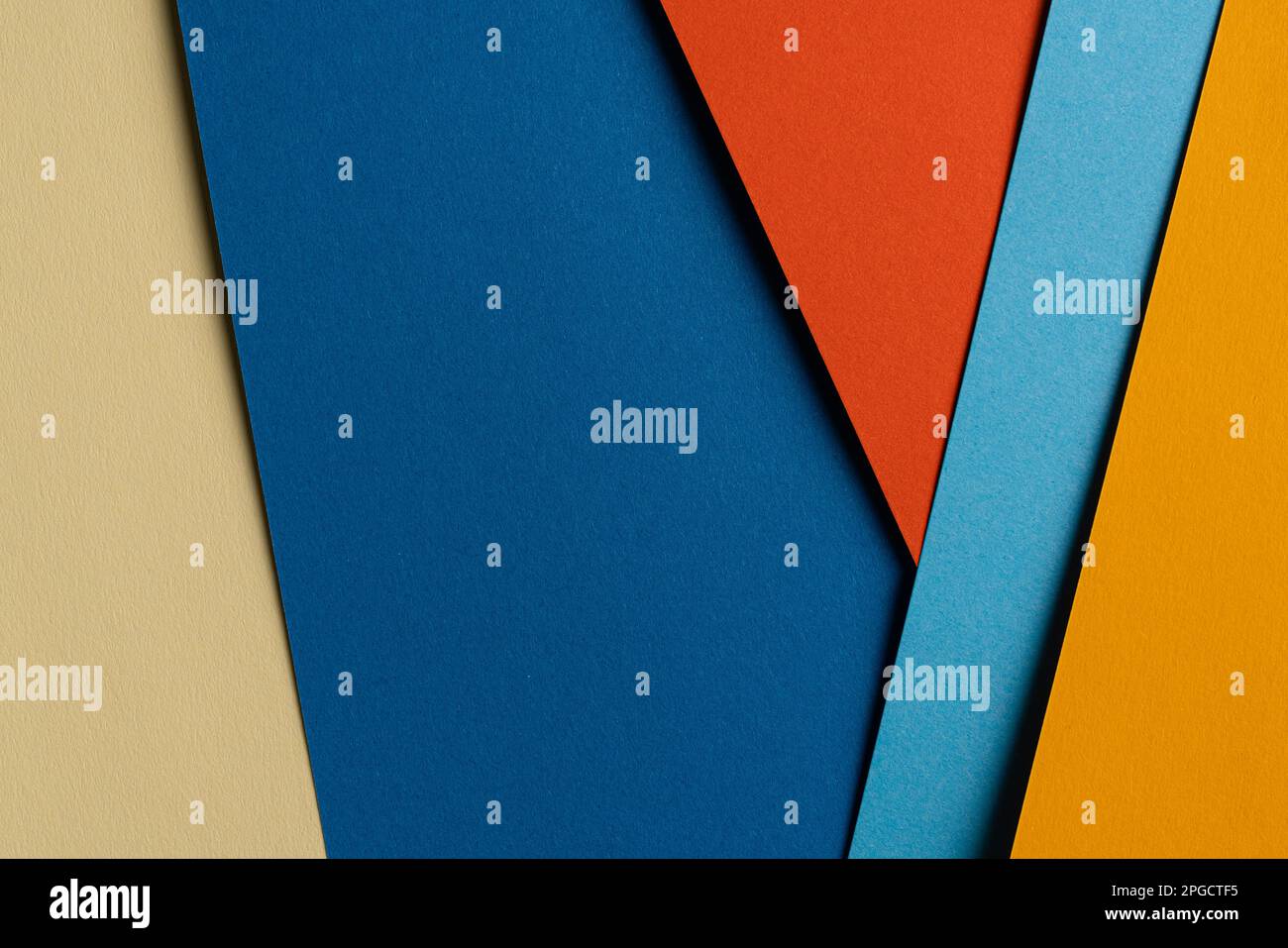 From above layout of colorful cardboard sheets in orange and blue ...