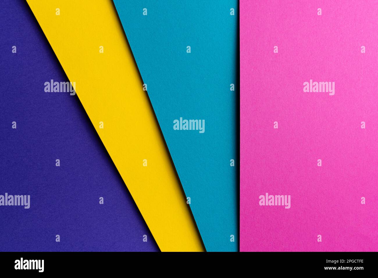 Layout of colorful cardboard sheets in blue, purple, pink and yellow ...
