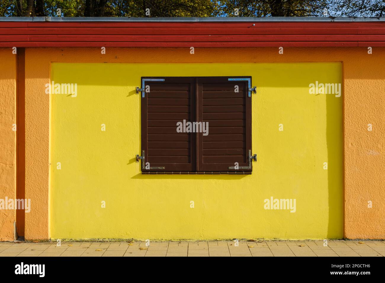 Colorful facade with closed window Stock Photo - Alamy