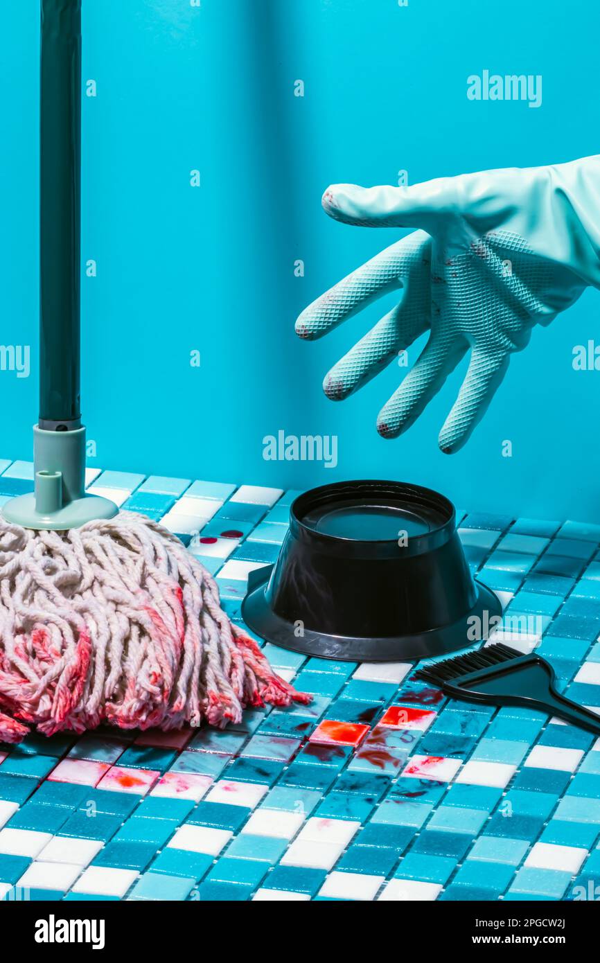Anonymous person in blue rubber gloves taking black bowl while cleaning ...