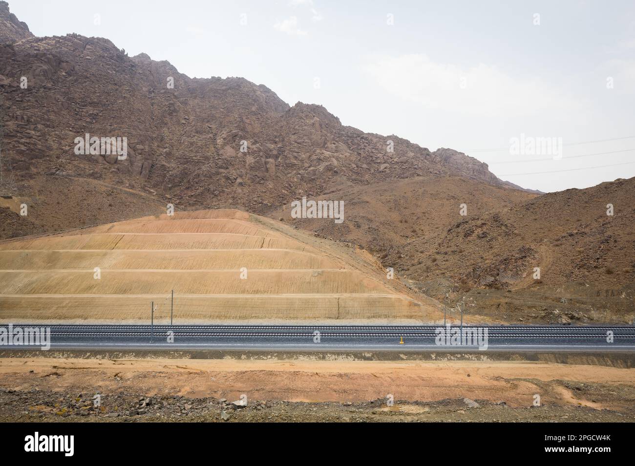 Aerial view of dry mountains with digging under infrastructure ...