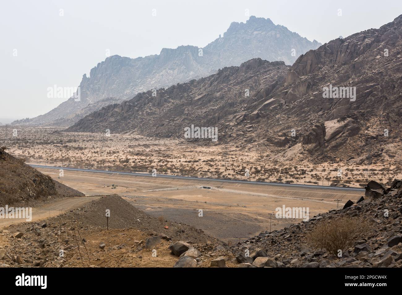 Aerial view of dry mountains with digging under infrastructure ...