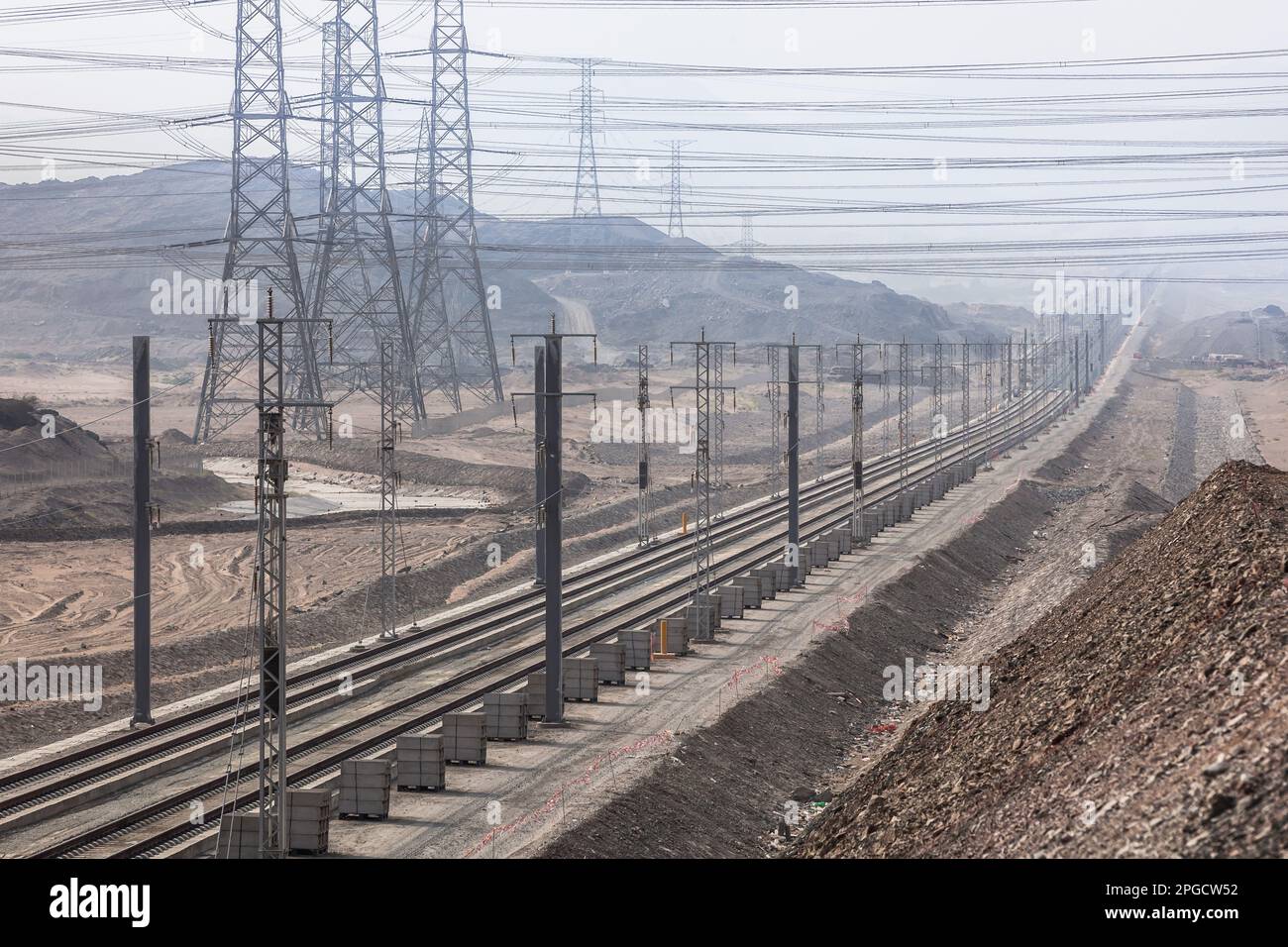 Aerial view of infrastructure development project with laying of railway tracks equipped with ...