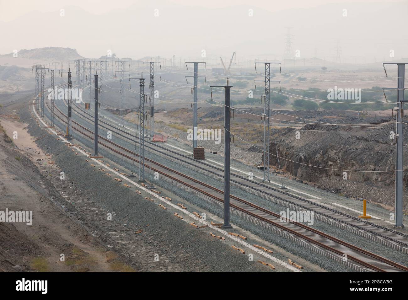 Aerial view of infrastructure development project with laying of railway tracks equipped with ...