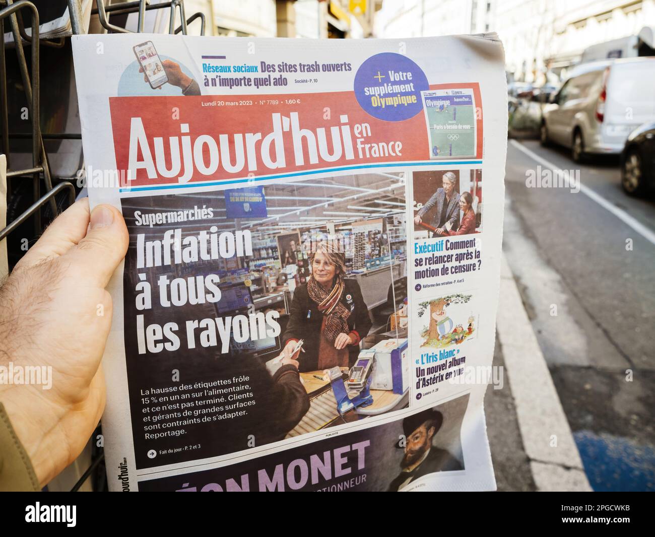 Paris, France - Mar 20, 2023: Aujord'hui en France newspaper being read ...
