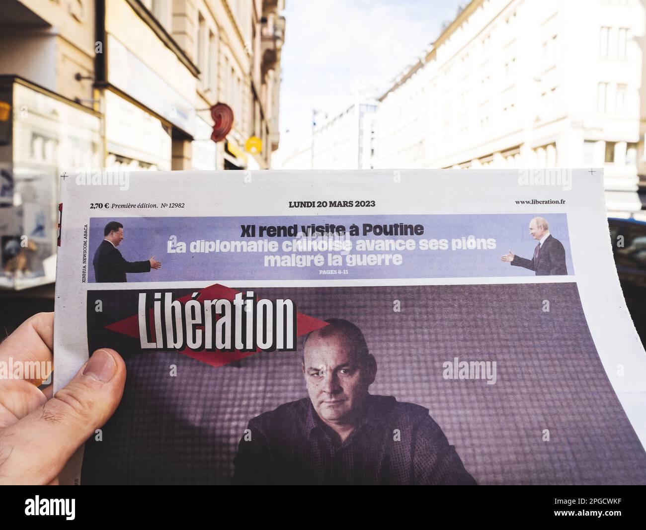 Paris, France - Mar 20, 2023: Male hand reading Liberation newspaper ...