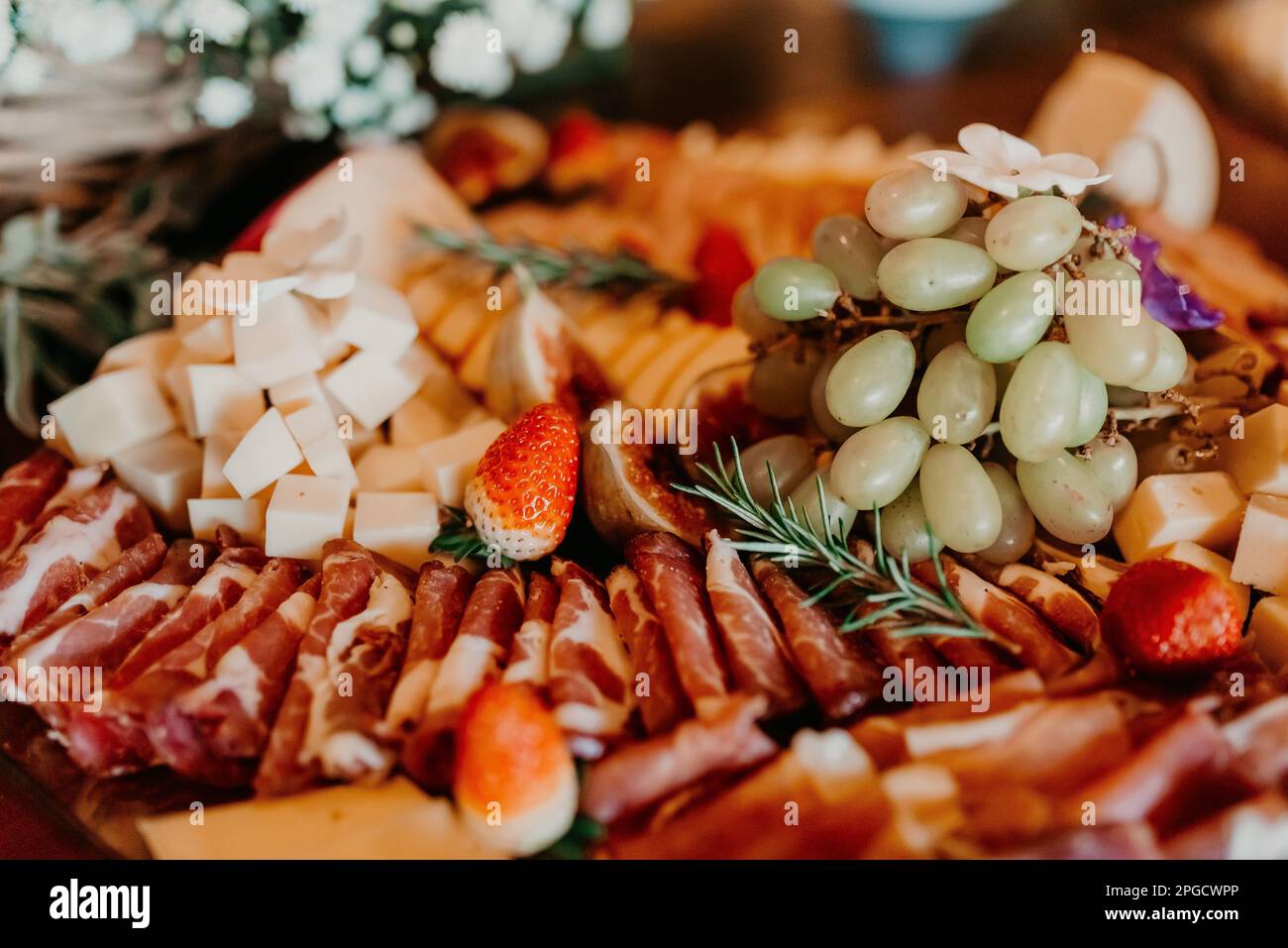 A serving platter filled with an assortment of snacks during the ...