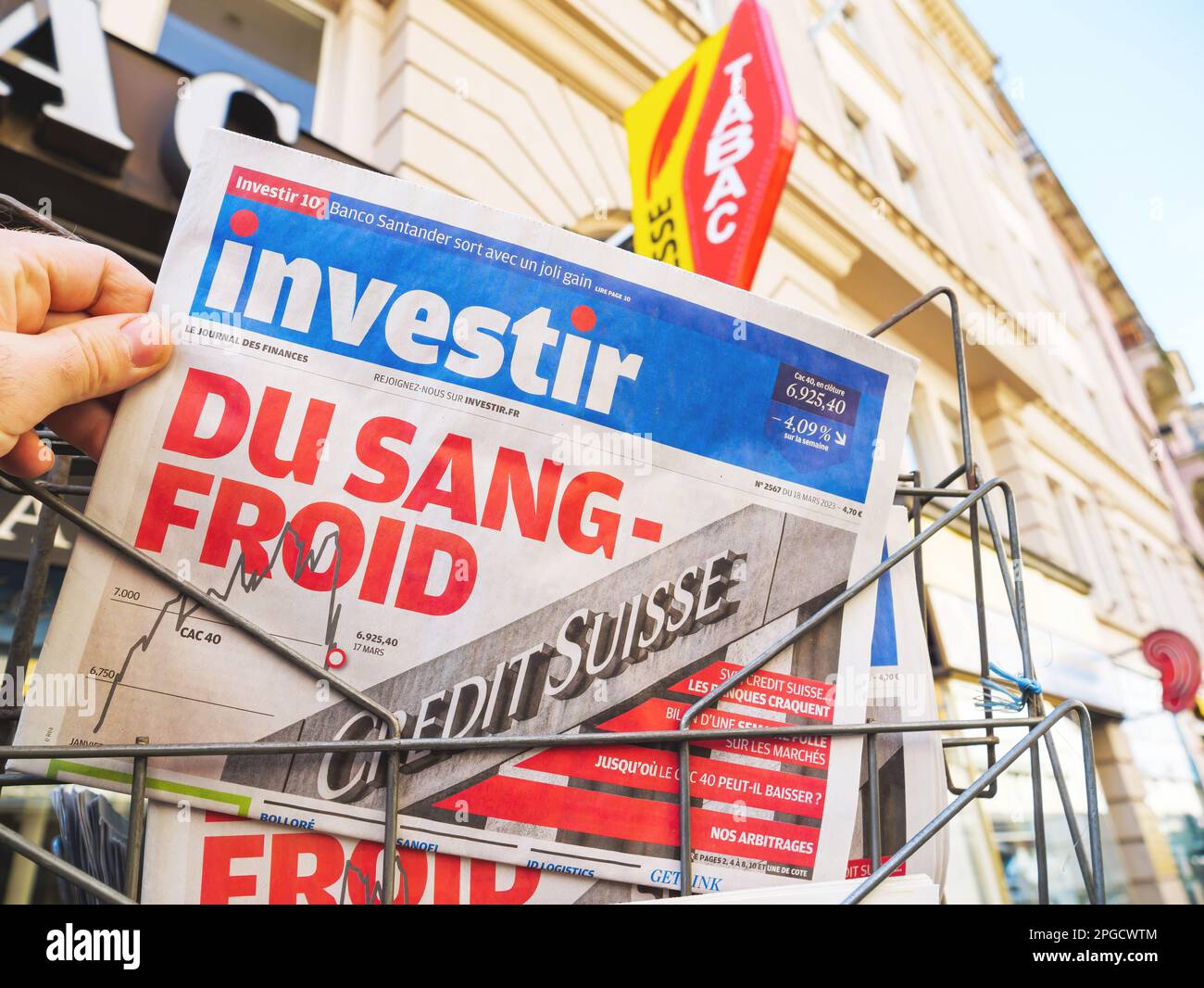 Paris, France - Mar 20, 2023: Investir newspaper with breaking news of ...