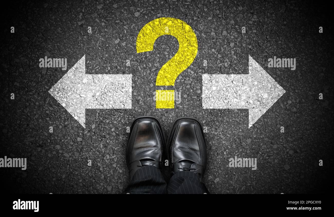Black business shoes, two arrows and question mark - problem concept ...