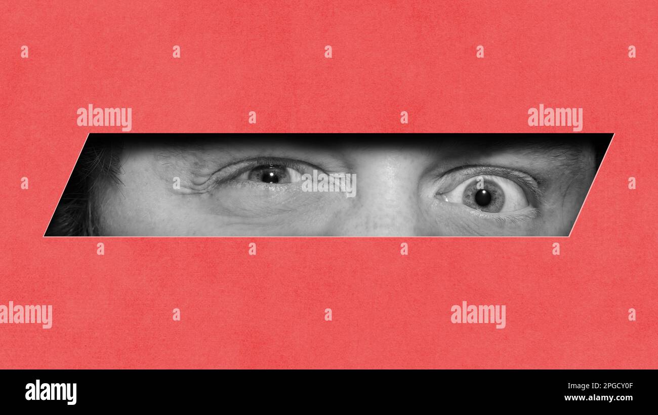 Suspicious look. Male attentive eyes looking out. Red background ...