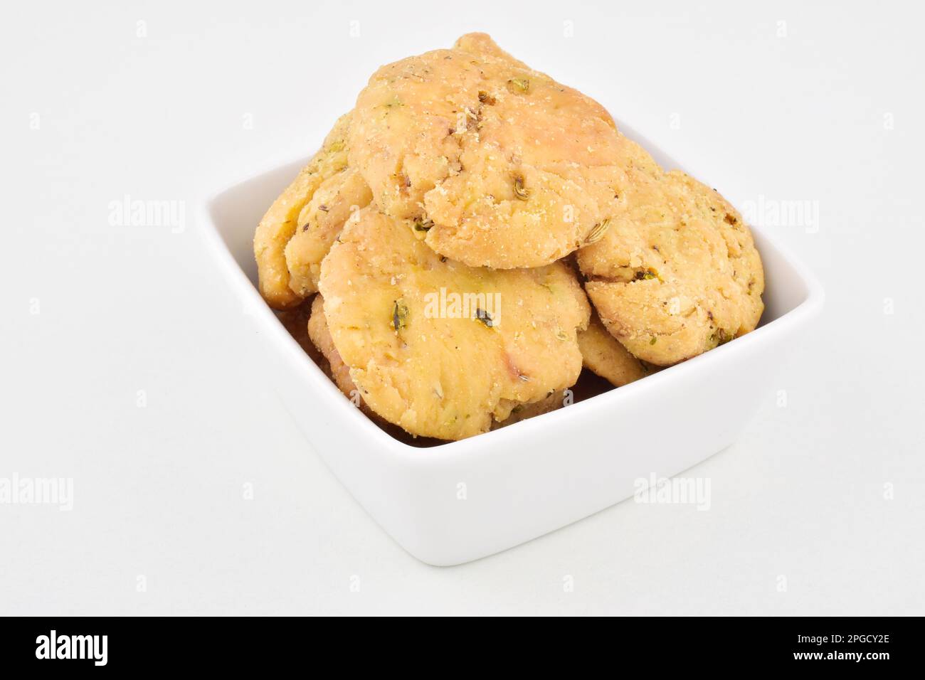 Mathri in bowl isolated on white background, indian snack methi mathri ...