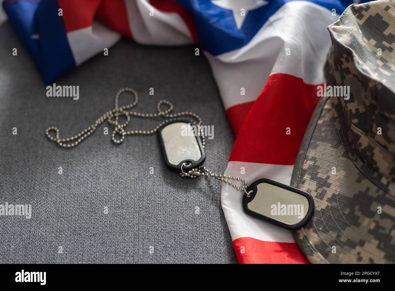 Army tokens on military uniform and USA national flag background Stock ...