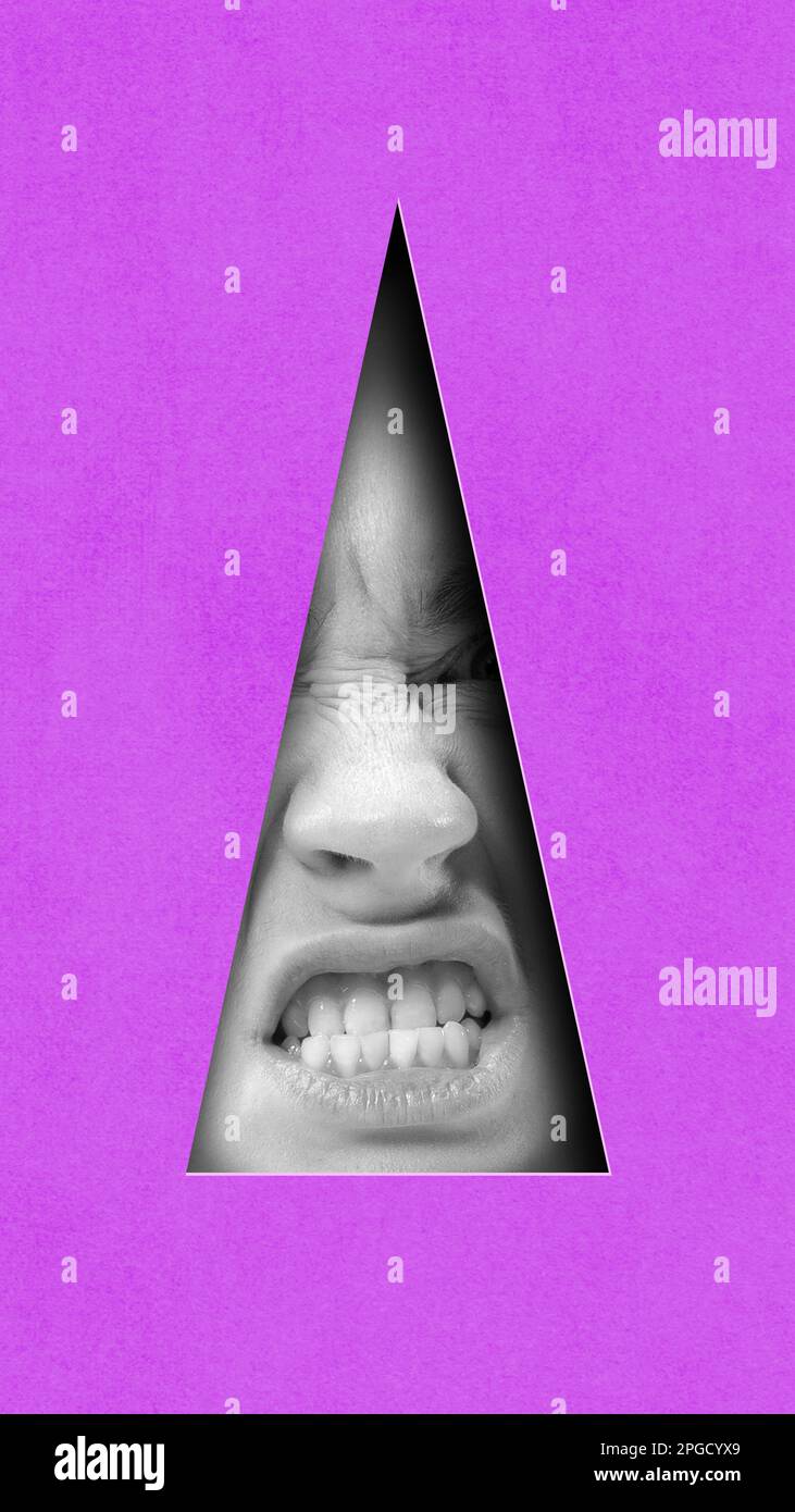 Irritation and anger. Black and white image of female face part peeking ...