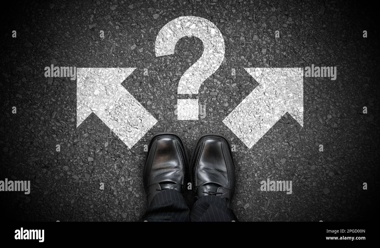 Black business shoes, two arrows and question mark - problem concept ...