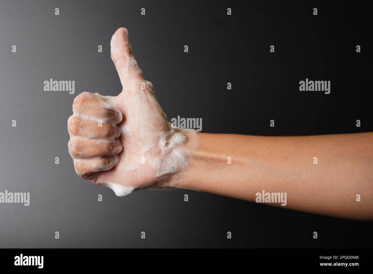 Foamy hand thumbs up gesture, hand wash concept Stock Photo - Alamy