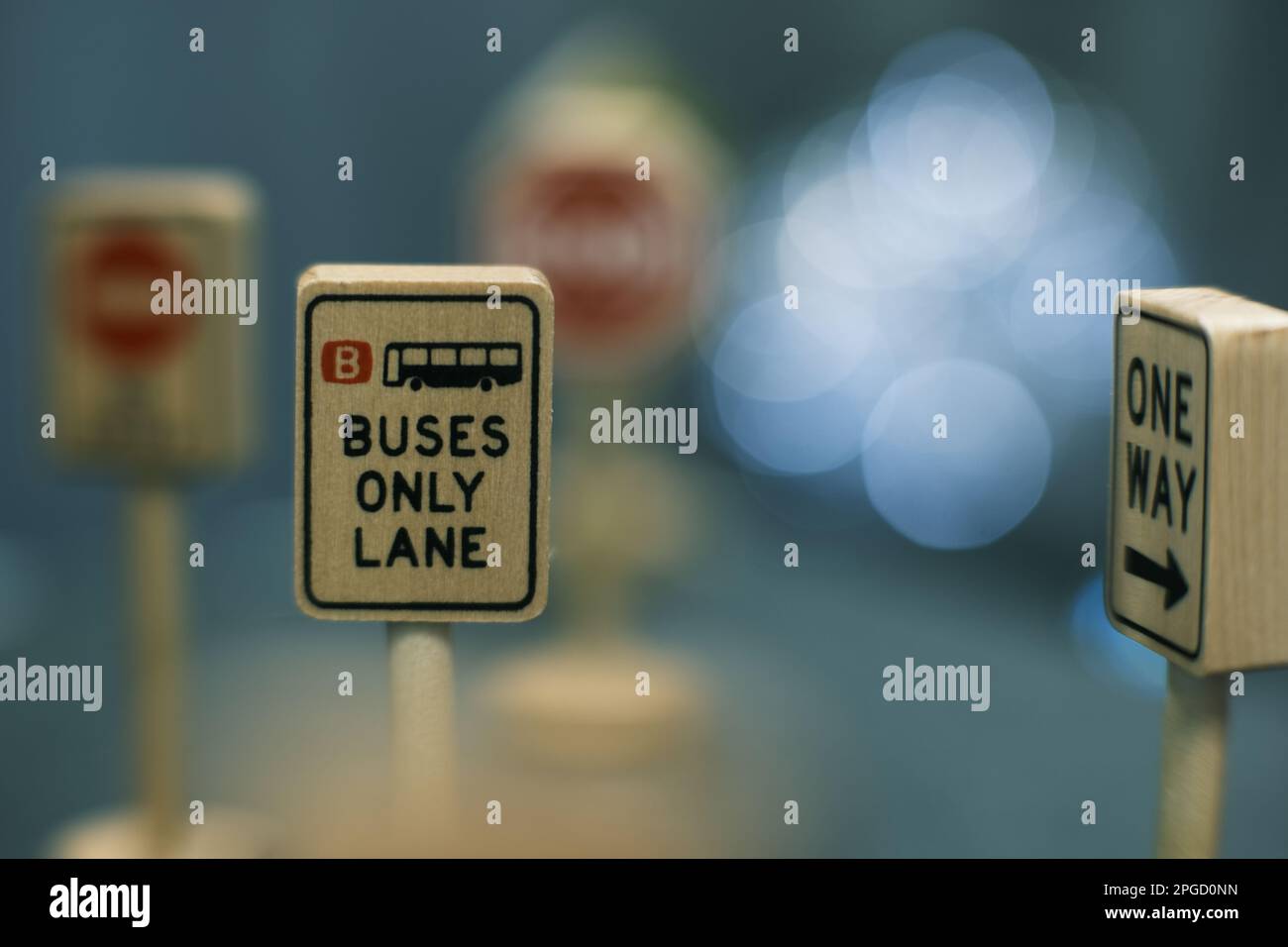 A miniature wooden buses only lane sign Stock Photo - Alamy