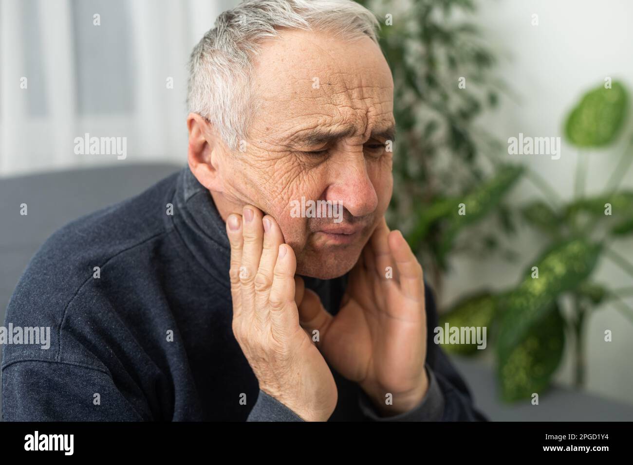Elderly Man Having Toothache Touching Cheek Suffering From Pain Sitting ...