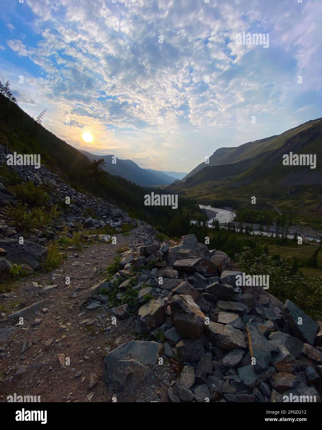 Panorama of a valley between mountains at sunset with the Chuya river ...