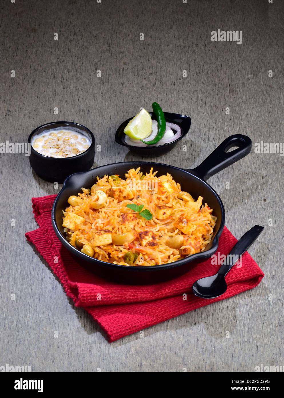 Veg biryani in pan with raita salad, indian food pulao Stock Photo - Alamy