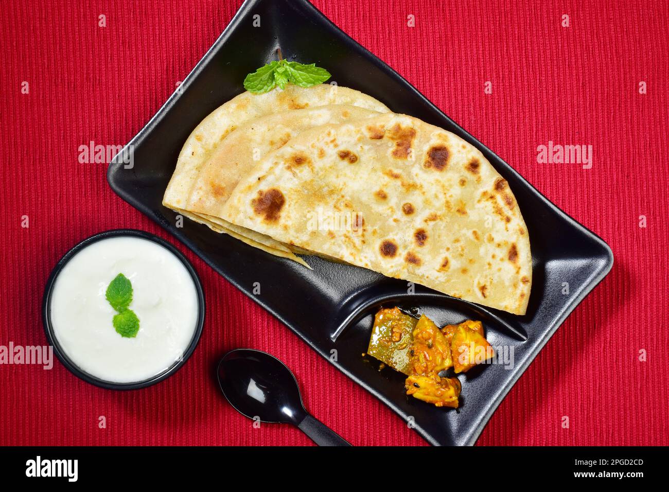 Top view of plain paratha served with dahi and achar Stock Photo - Alamy