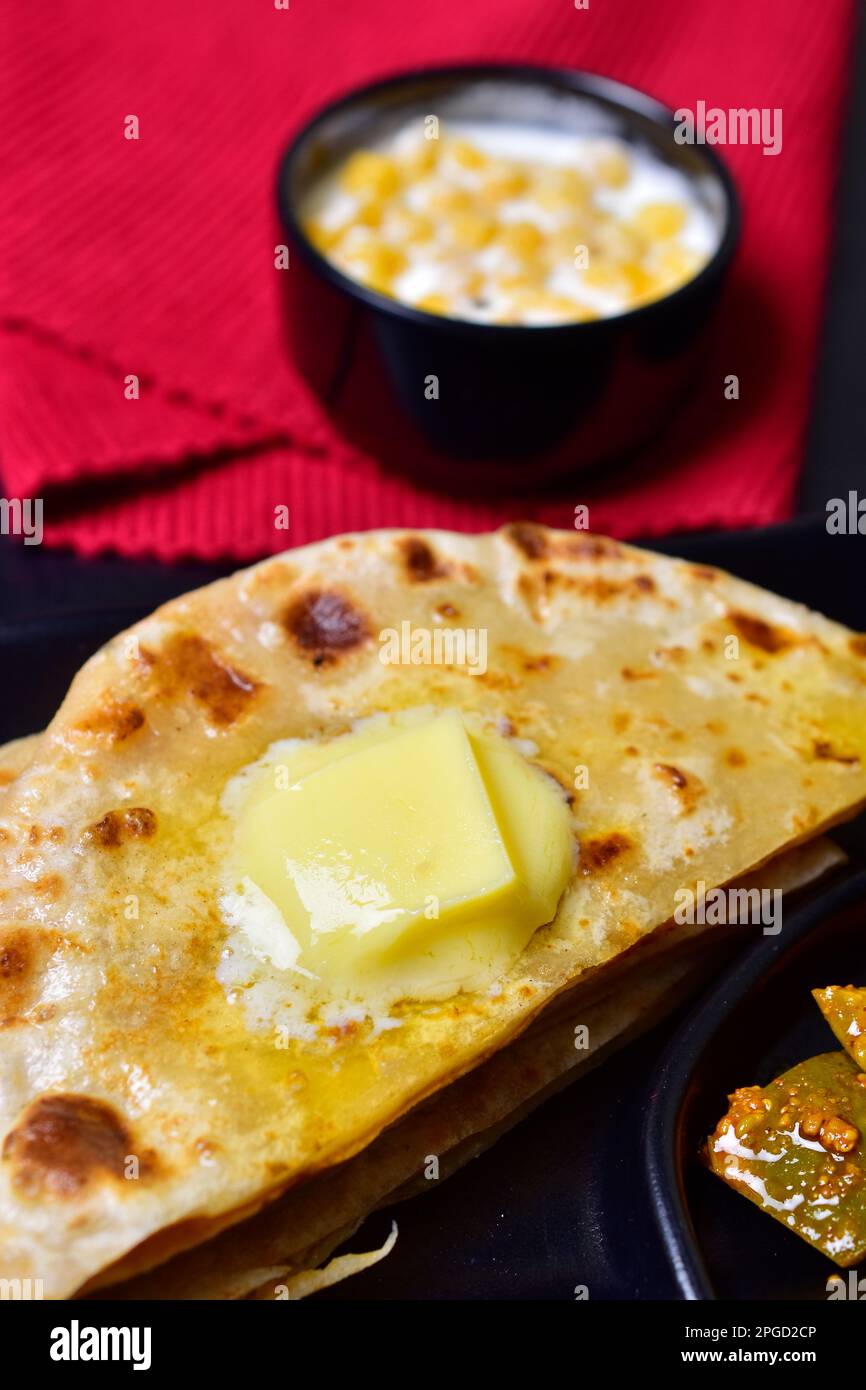 Butter paratha with raita, indian calorie food Stock Photo - Alamy