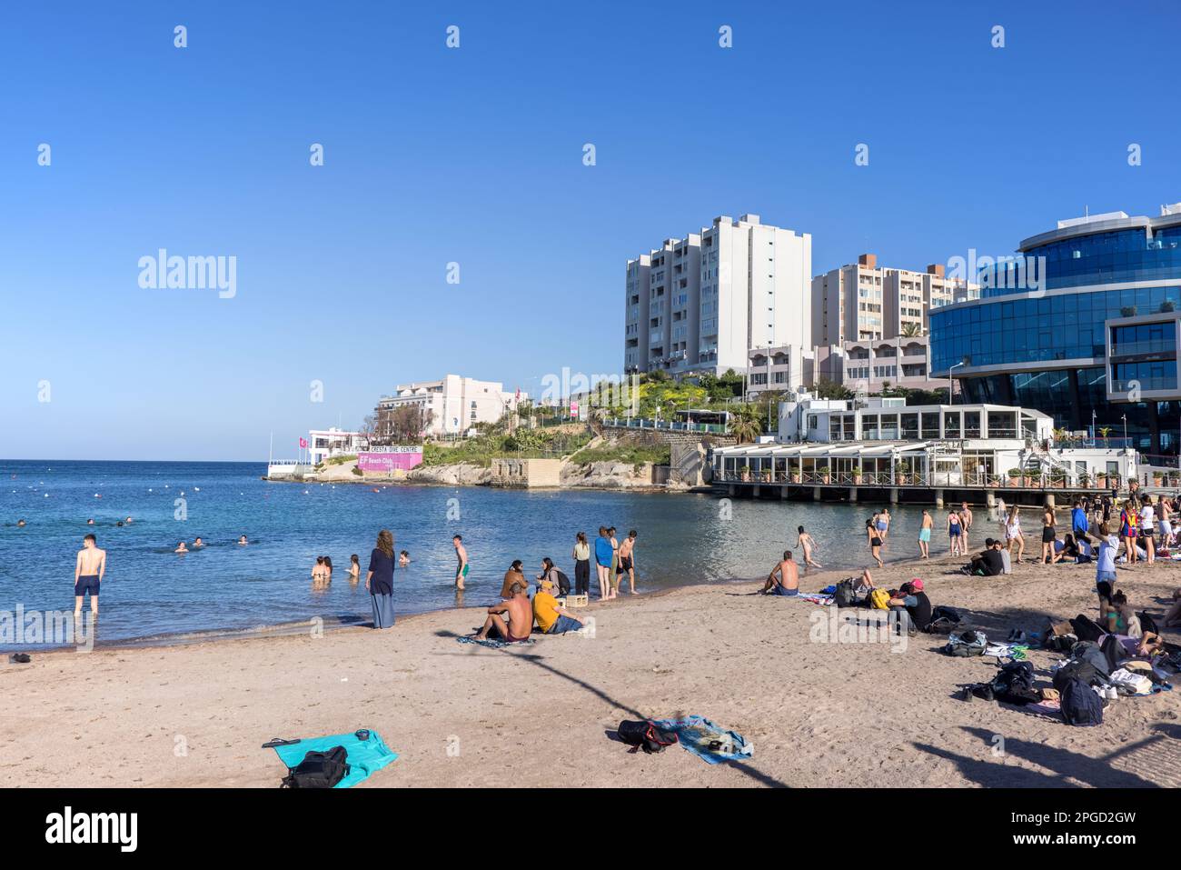 the sandy beach in st georges bay in st julians malta Stock Photo - Alamy