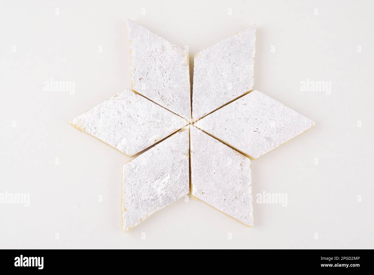 Top view of kaju katli on white background, indian sweet Stock Photo ...