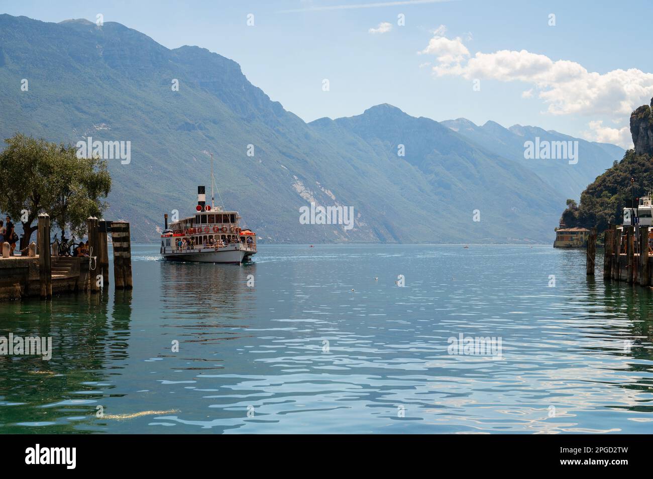 Paddle steamer Italia, vintage passenger boat pulling into Riva on Lake ...
