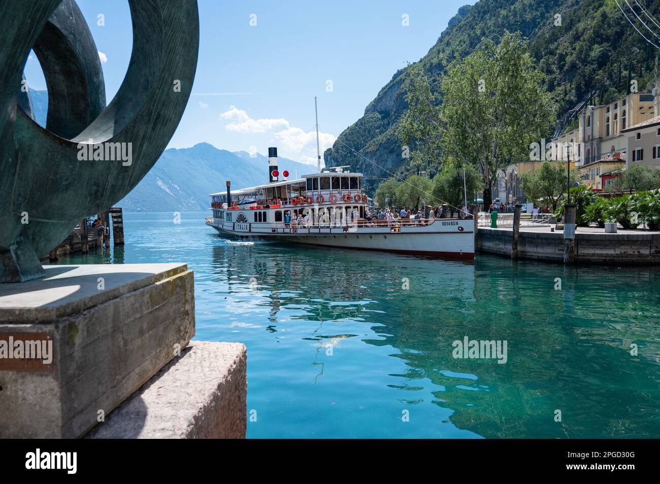 Paddle steamer Italia, vintage passenger boat pulling into Riva on Lake ...