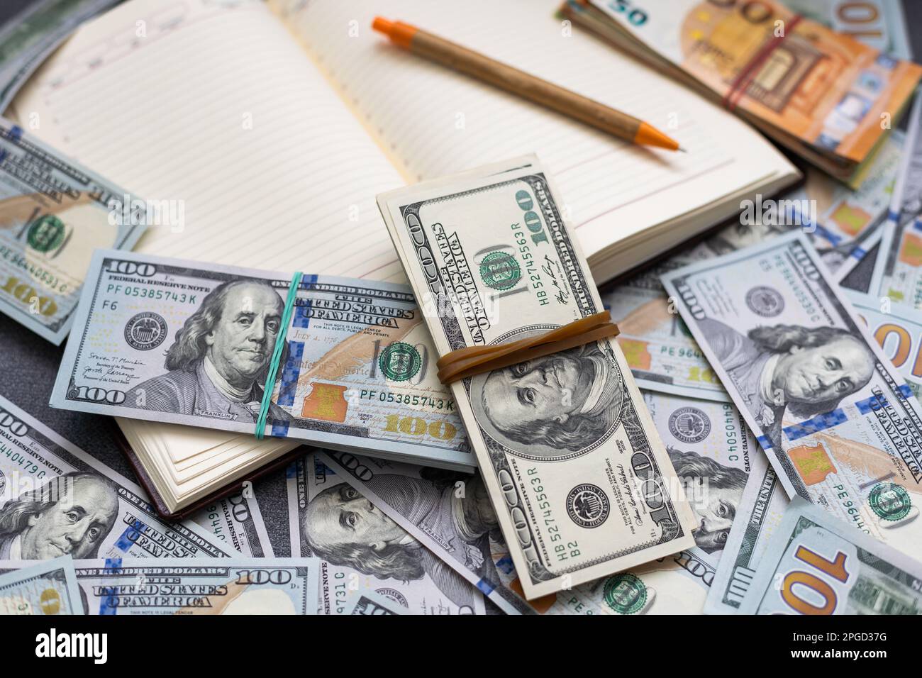 Notebook with vintage fountain pen and euro banknotes between the pages ...