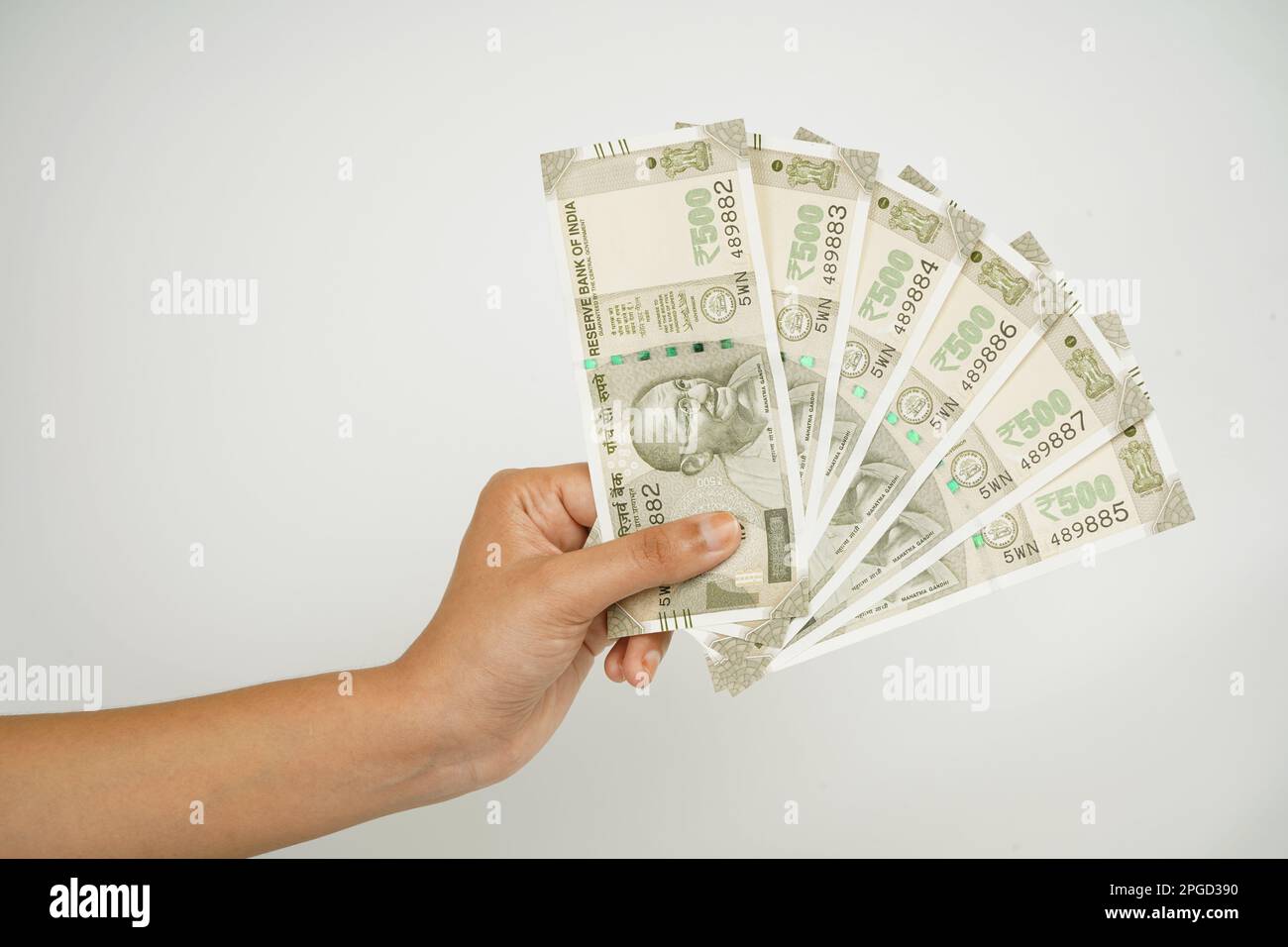 Rupees in hand hi-res stock photography and images - Alamy