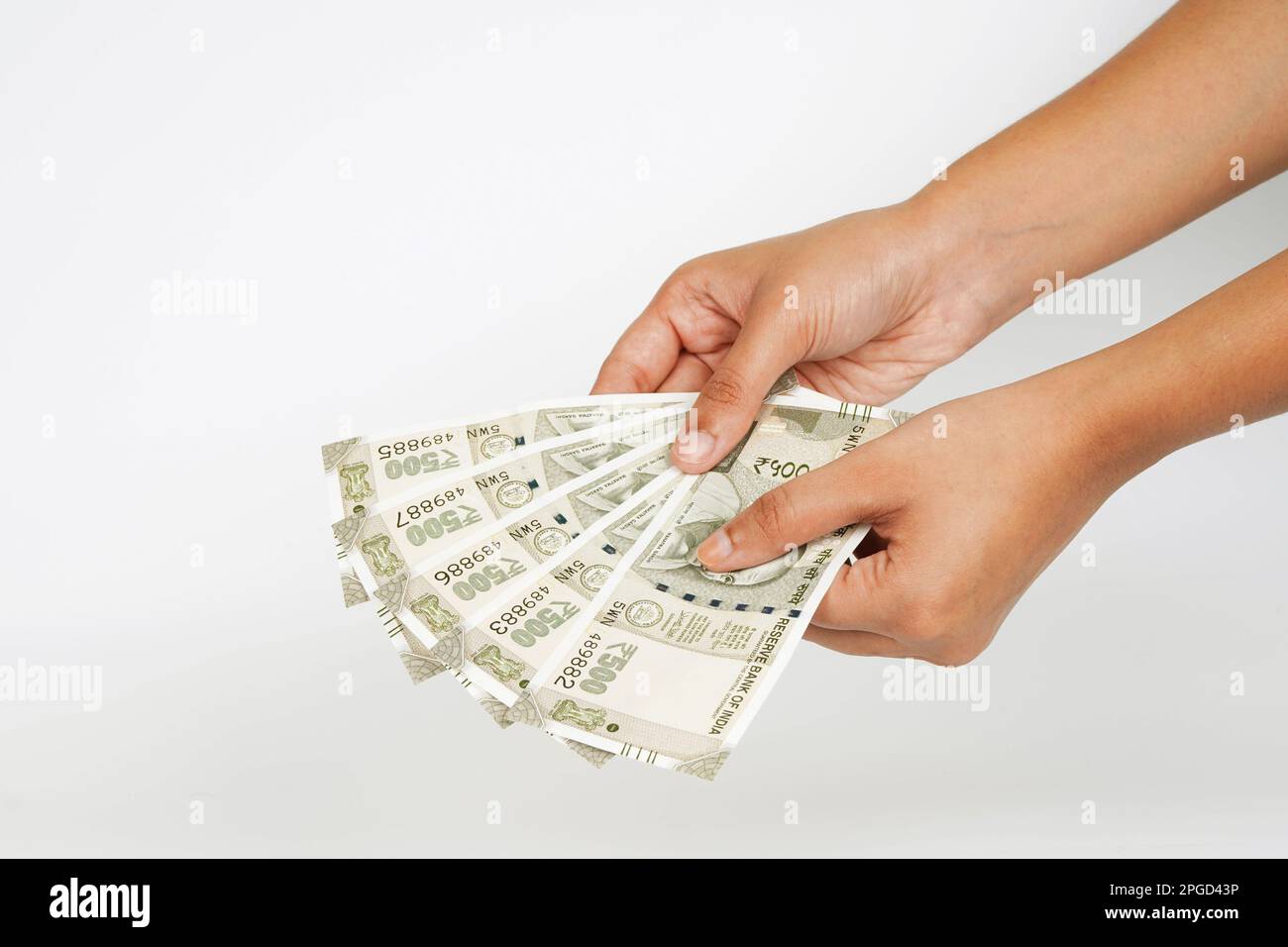 Rupees in hand hi-res stock photography and images - Alamy