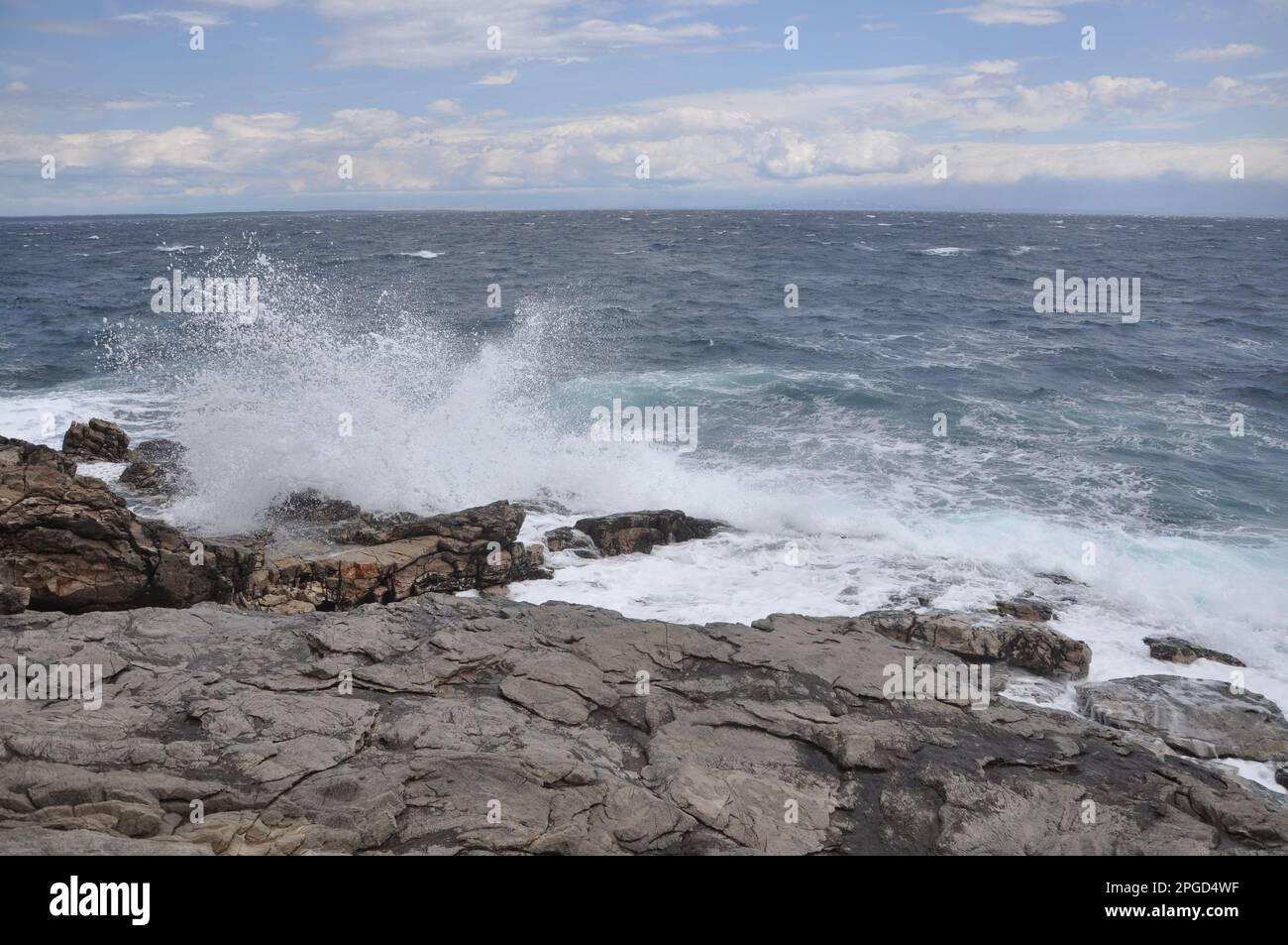 The sea wave crashing on the rock and make the splashing water and ...