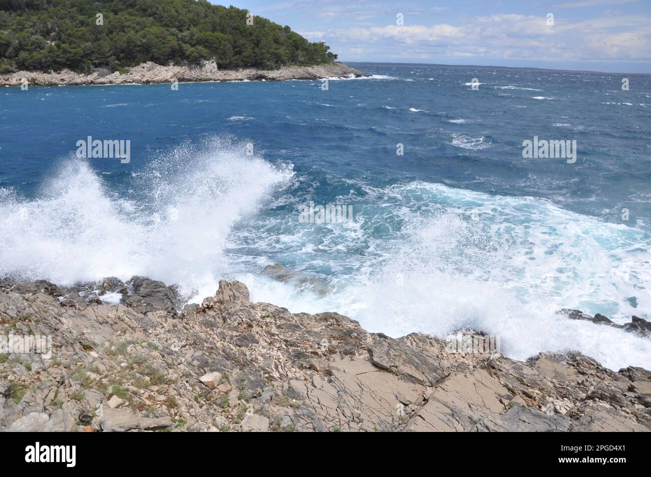 The sea wave crashing on the rock and make the splashing water and ...