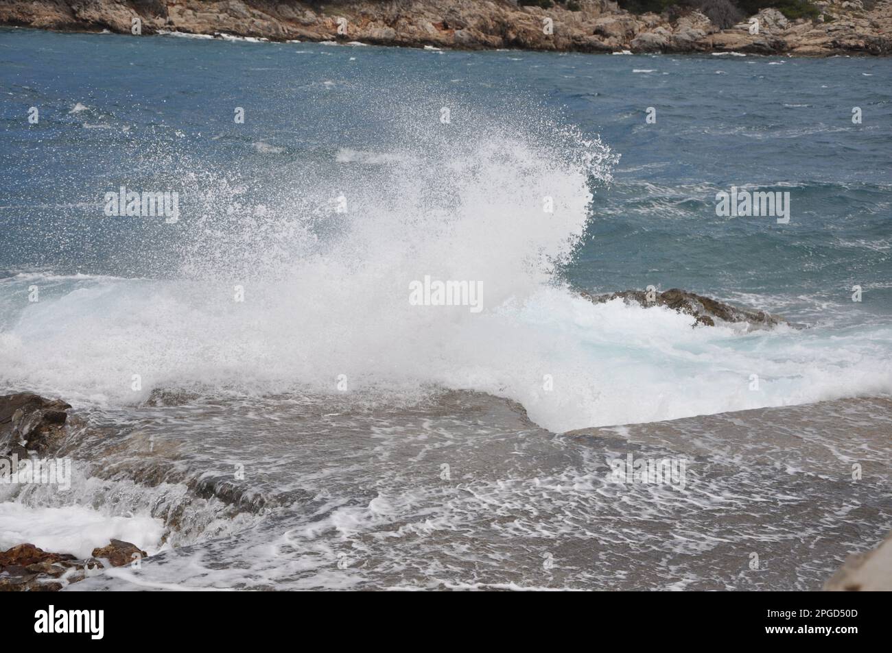 The sea wave crashing on the rock and make the splashing water and ...
