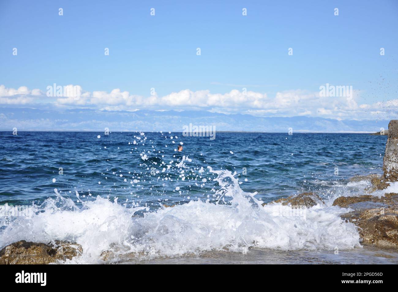 Wave breaking on the beach.Breaking sea wave on the rocky coast.The sea ...