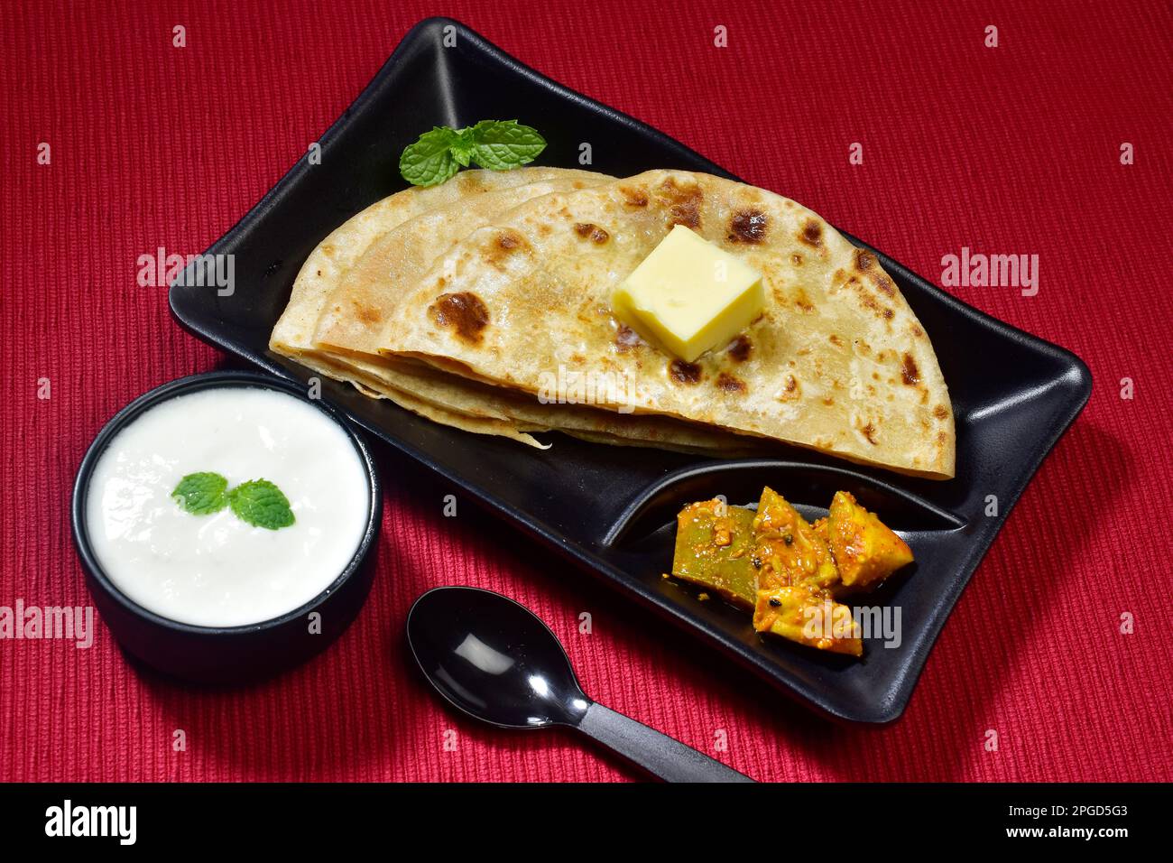 Stuffed paratha with dahi and achar, healthy indian breakfast with full ...