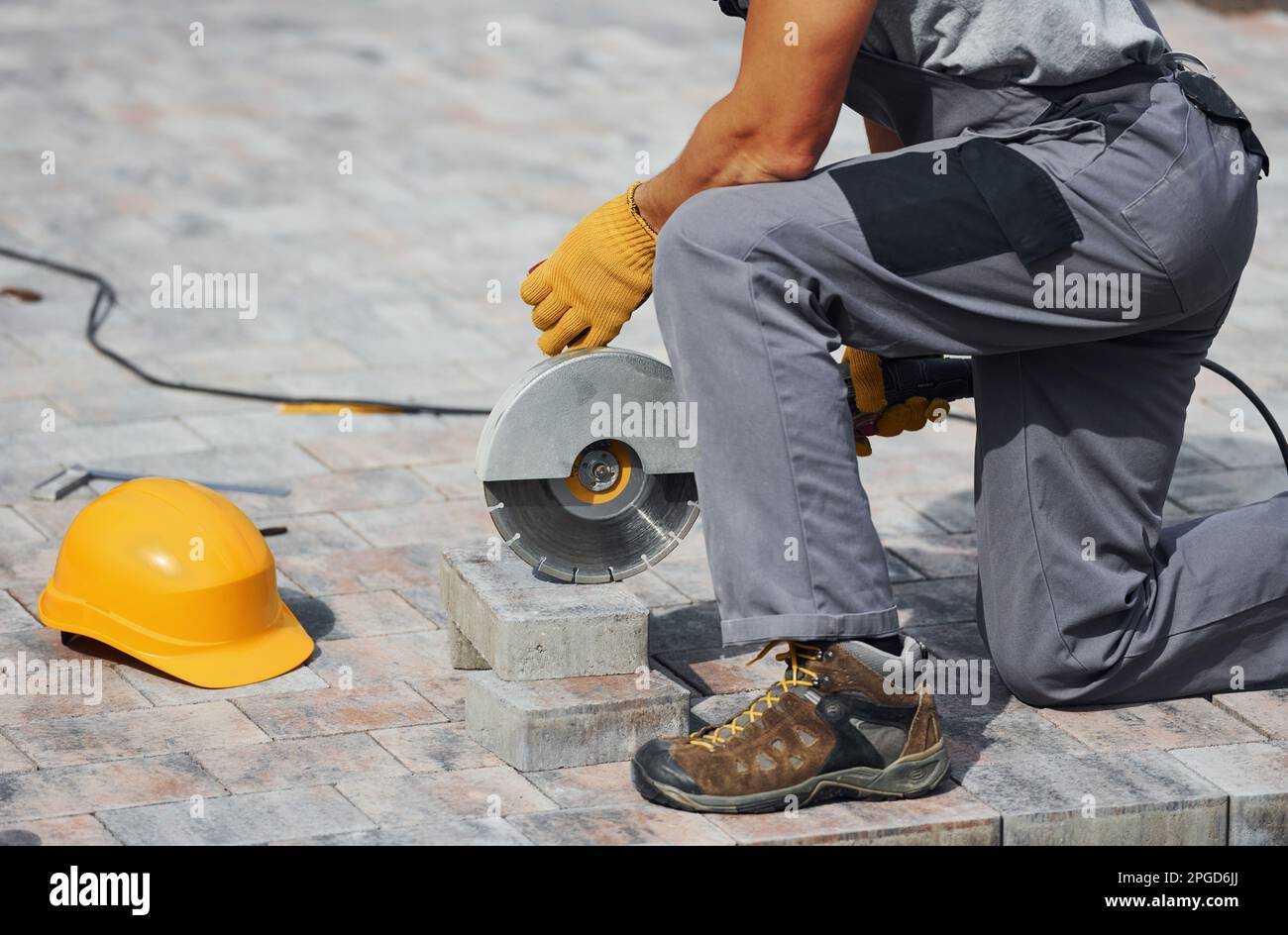 Close up view. Male worker in yellow colored uniform have job with ...