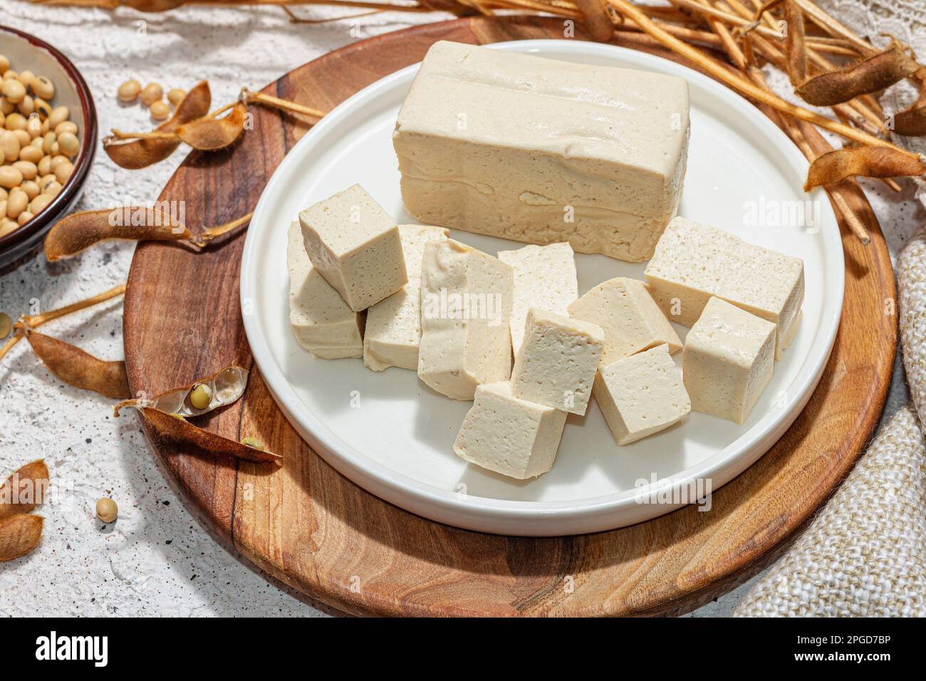 Fresh Tofu cheese with soybeans. Cube pieces, healthy ingredient for vegan lifestyle, modern ...