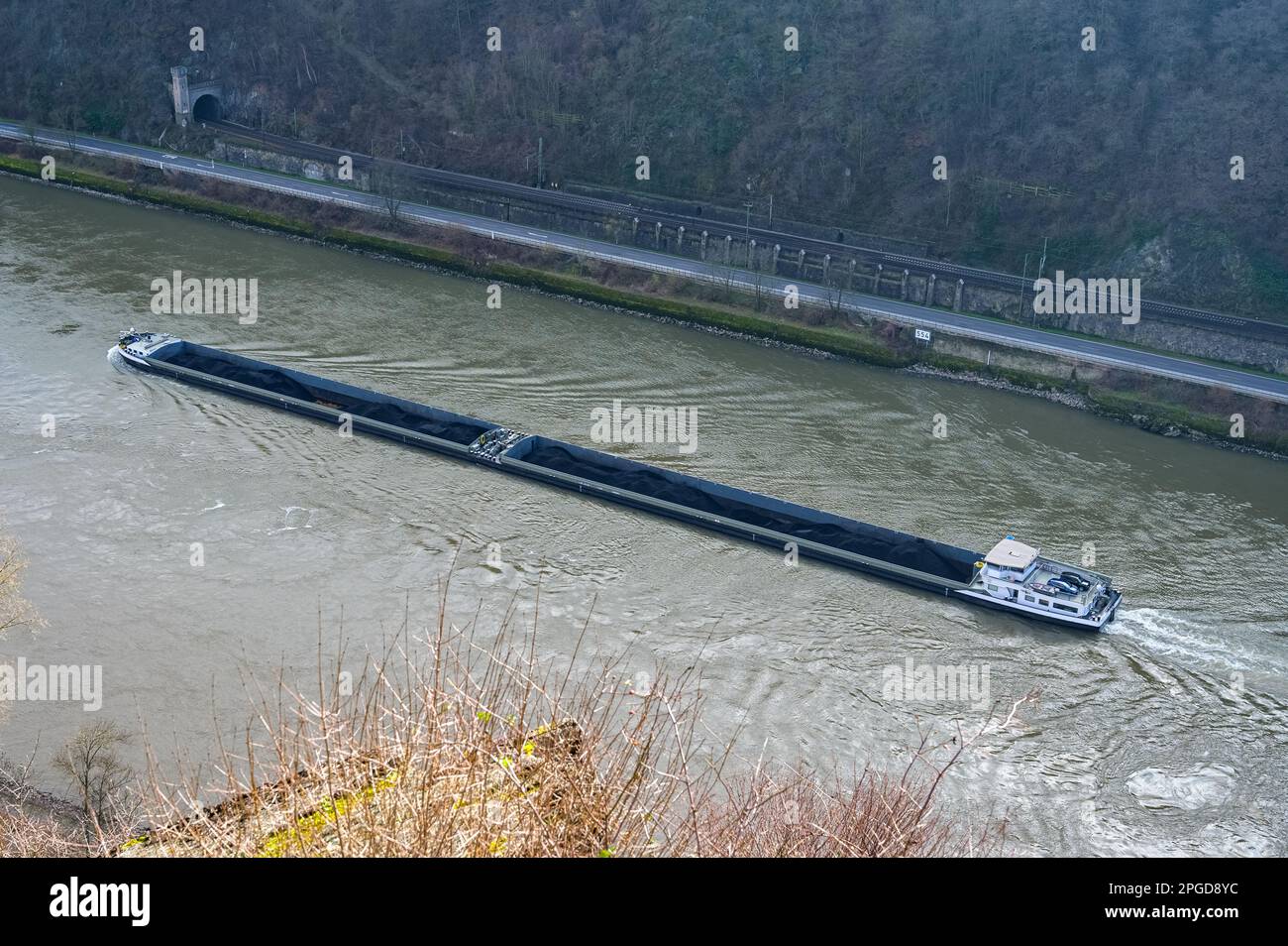 A barge filled with black coal seen from above passing the famous ...