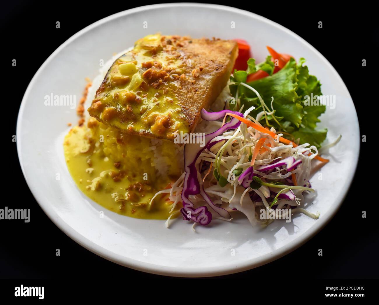 Grilled basa fish with rice and salad on black background Stock Photo ...