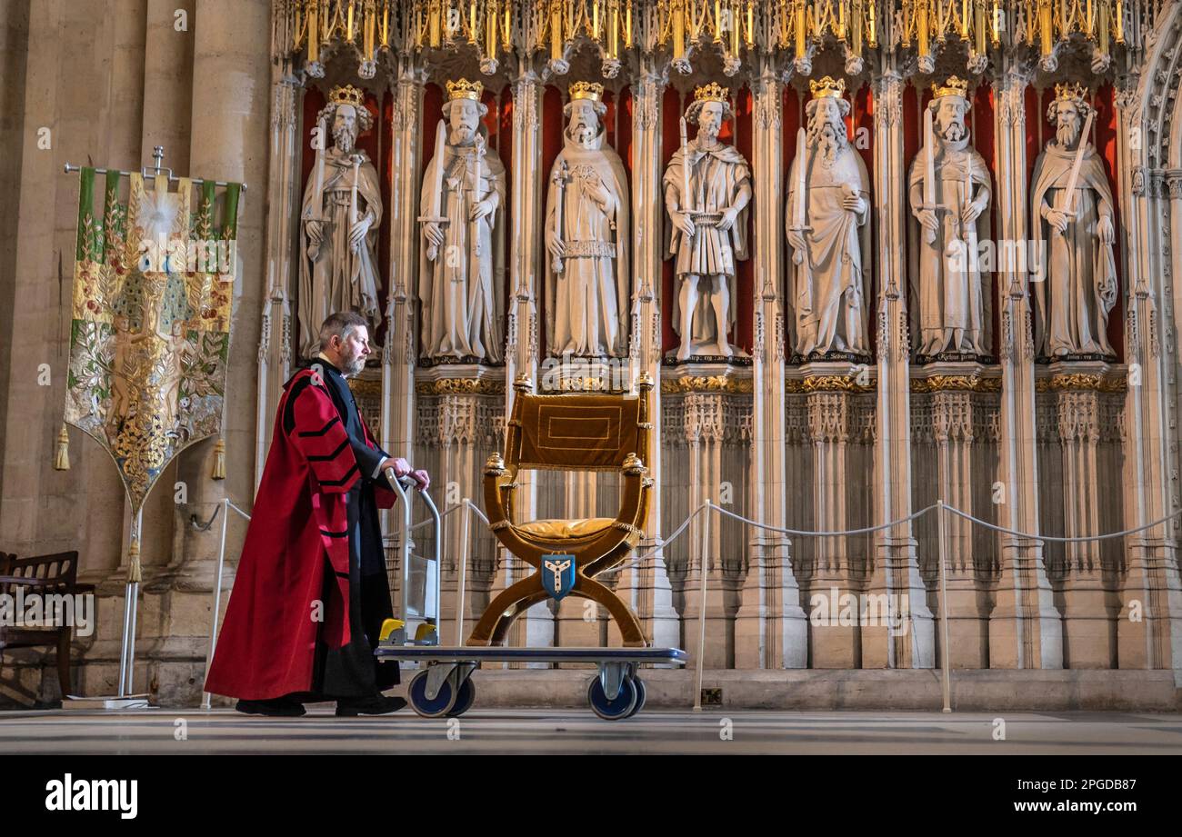Head verger Alex Carberry moves a chair known as the coronation chair ...