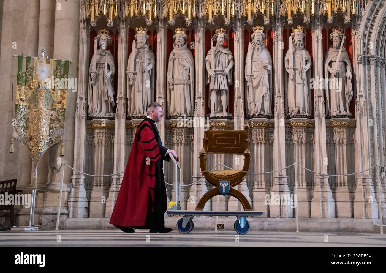 Head Verger Alex Carberry moves a chair known as the coronation chair ...