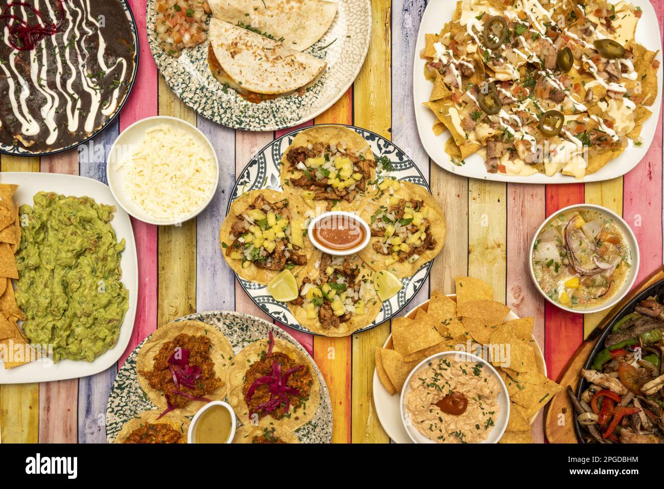 Plate set with Mexican food recipes with tacos of all kinds on wheat ...