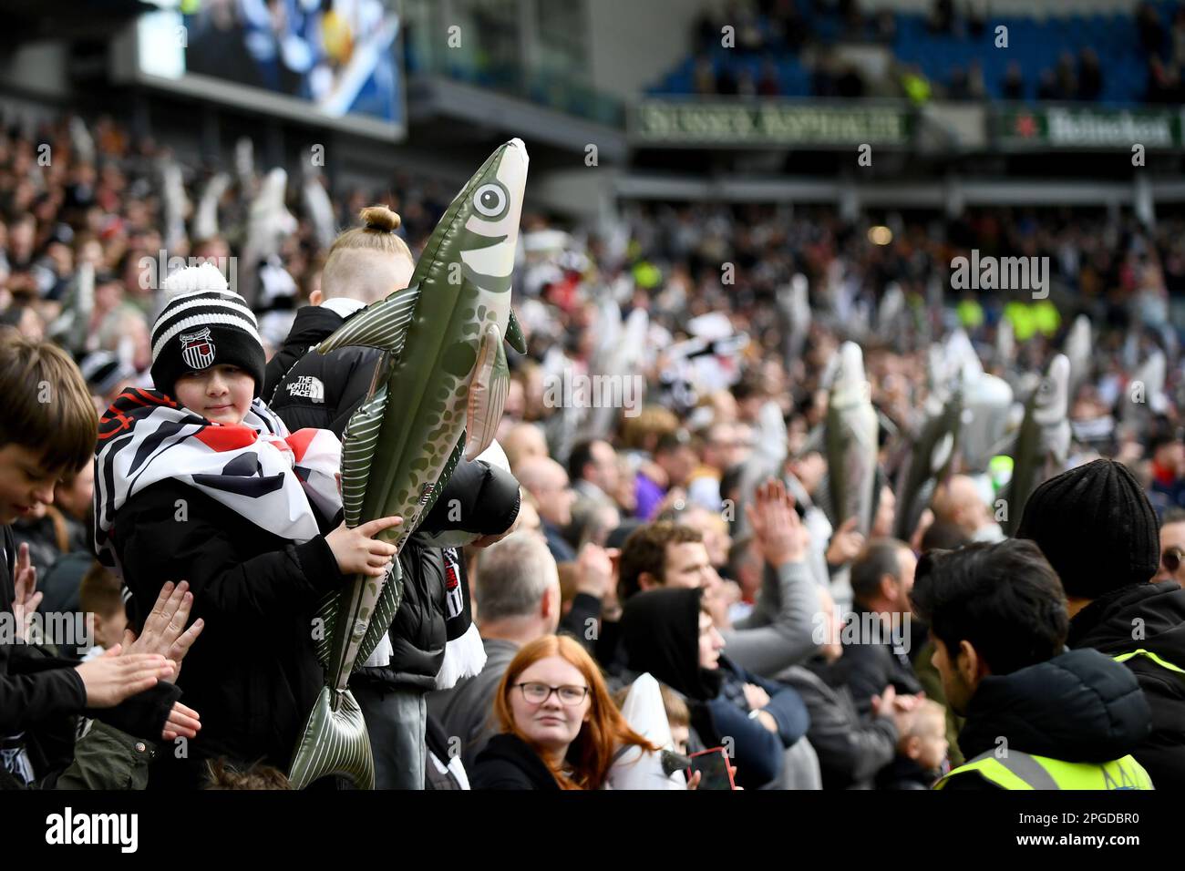 Grimsby Town fans are seen with Harry the Haddock inflatables ...