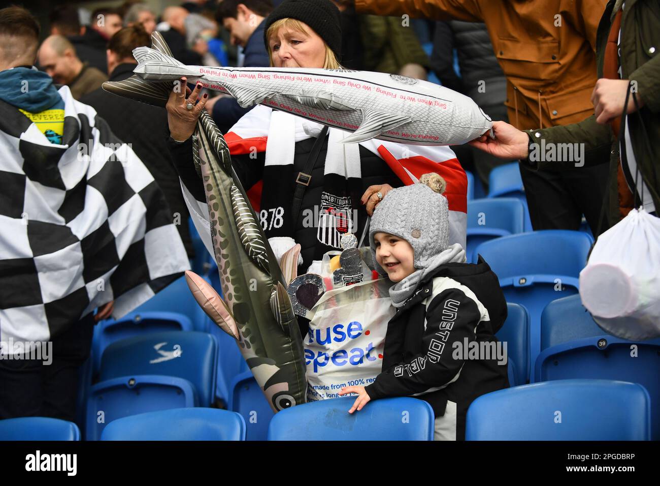 Grimsby Town fans are seen with Harry the Haddock inflatables ...