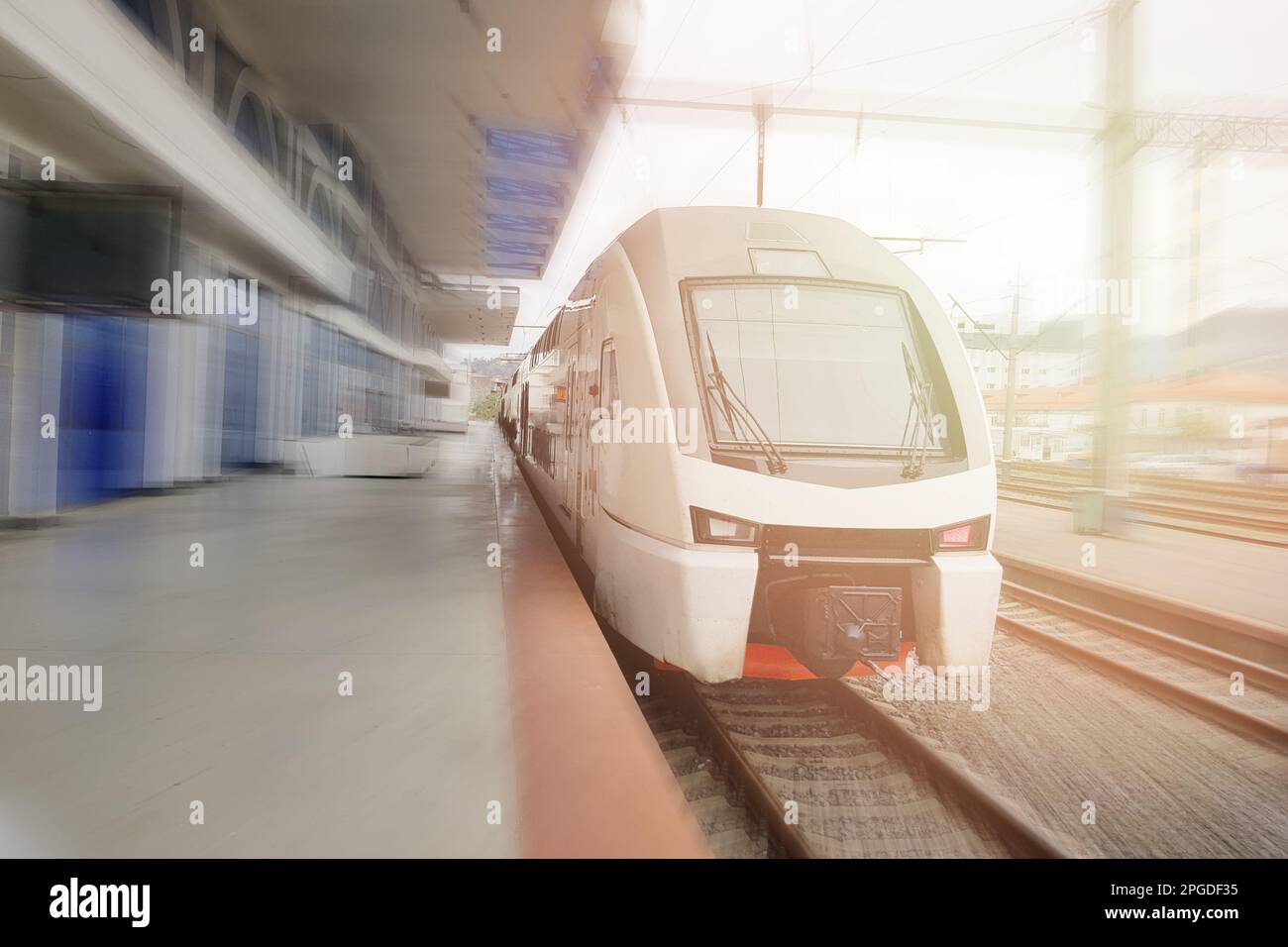 Fast modern electric train on the railway station Stock Photo - Alamy